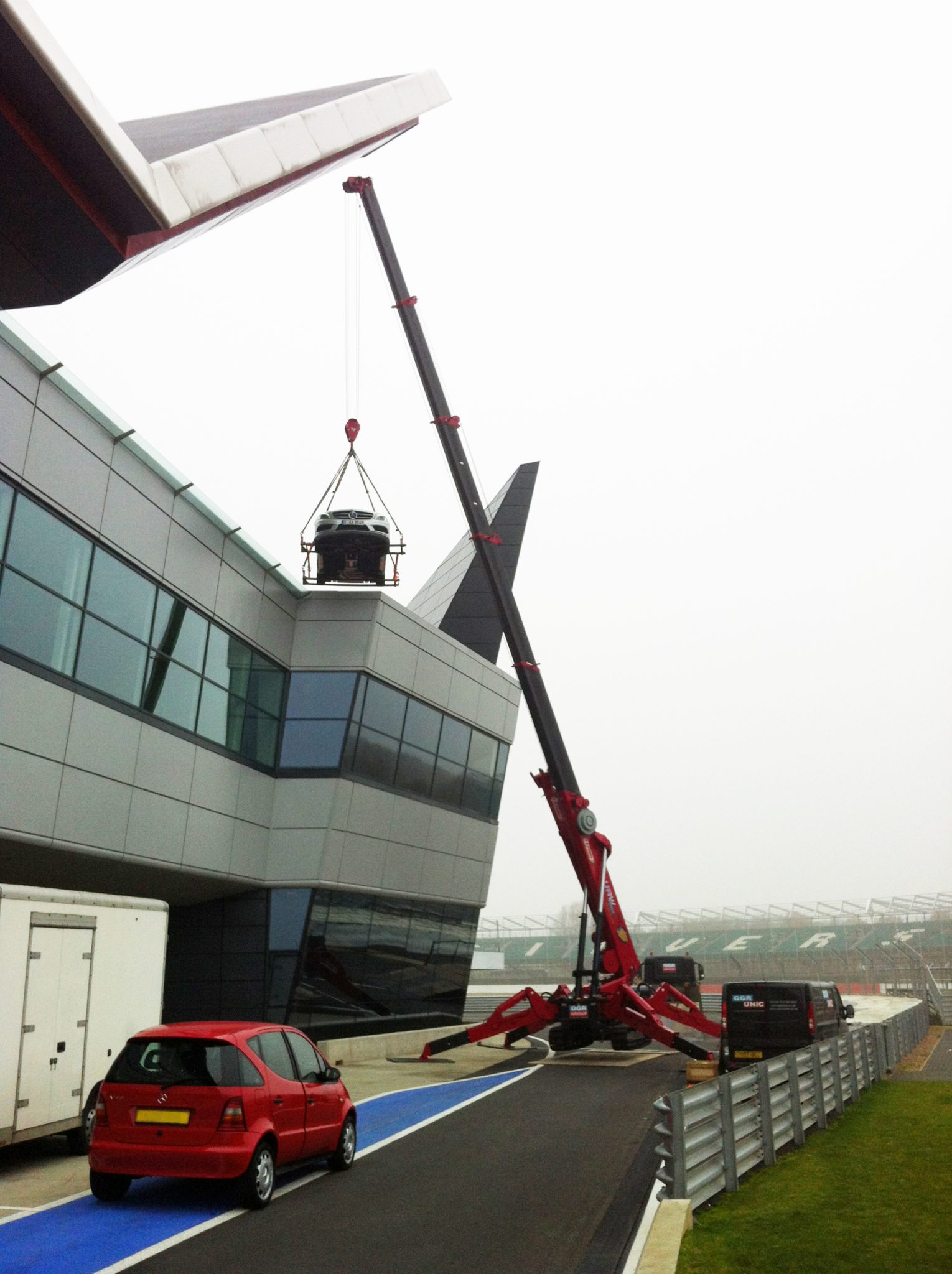 GGR mini spider crane lifts cars at Silverstone race circult | Lift and ...